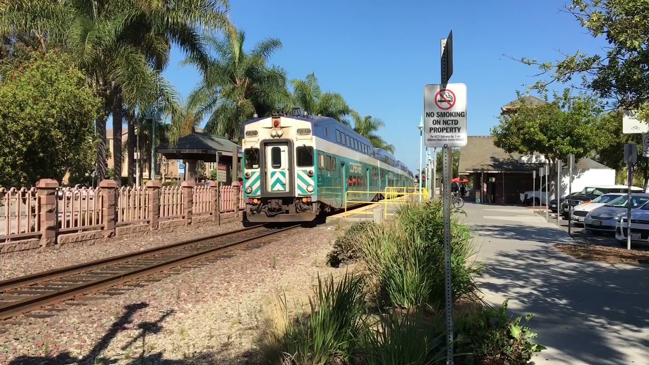 Coaster Cab Car 2301 leads a Southbound Coaster out of Carlsbad Village ...