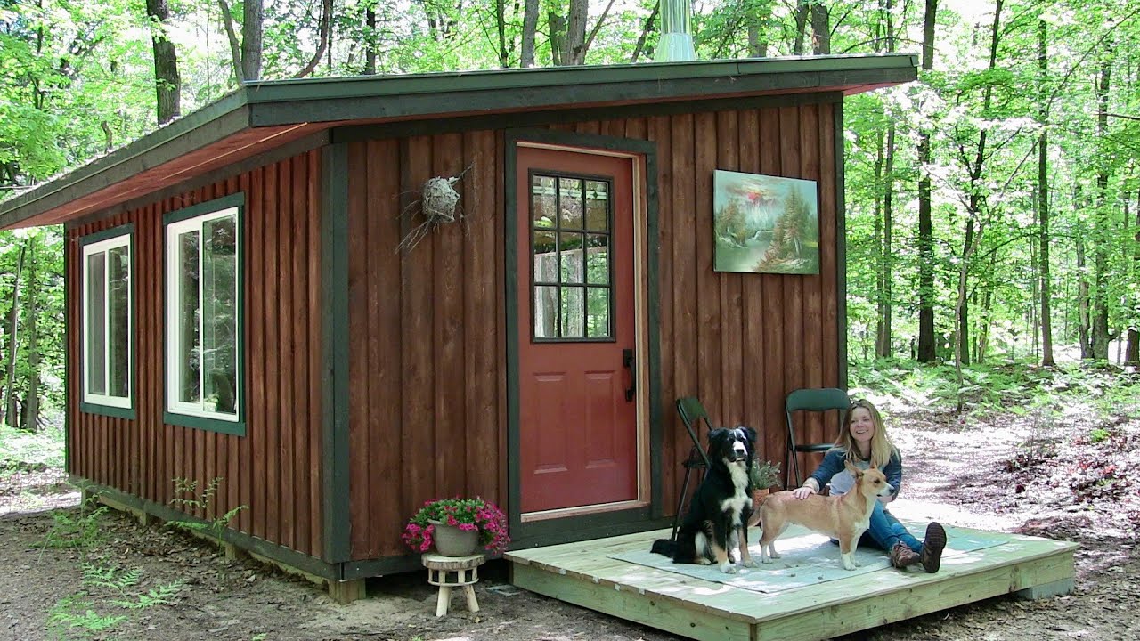 the off grid cabin building a porch and a fire pit - YouTube