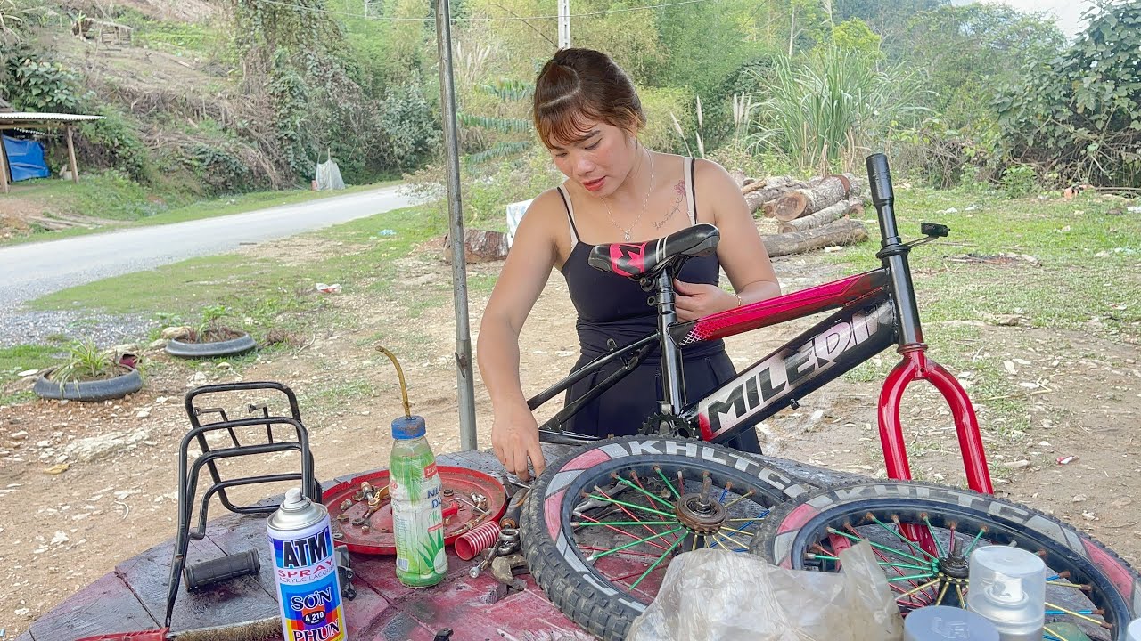 The girl repaired the badly damaged bicycle. - YouTube
