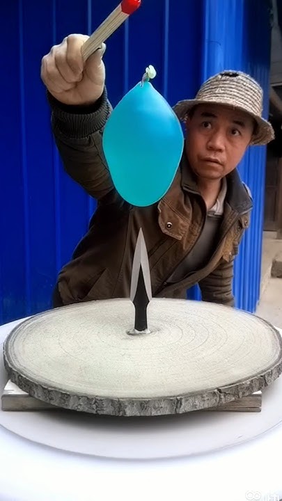 See why a water-filled balloon doesn't burst even when placed on a sharp knife? - YouTube