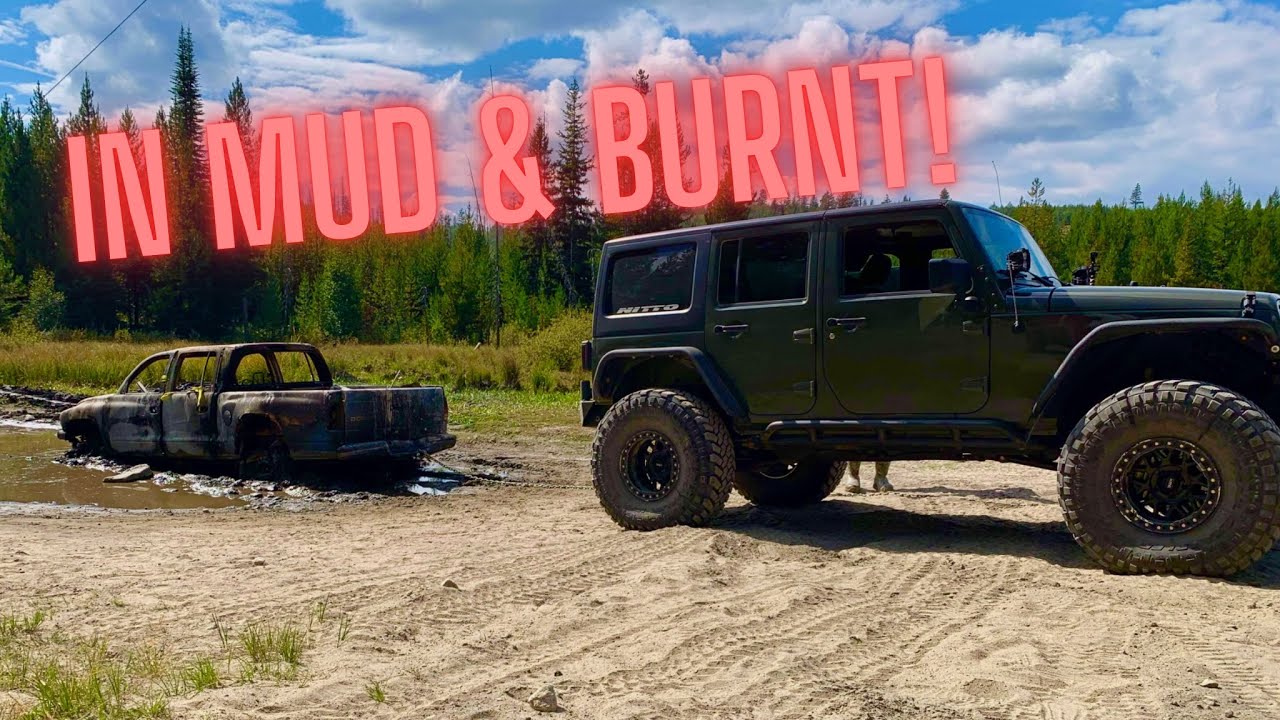 Burnt Truck Stuck In Mud! Can we drag it out? - YouTube
