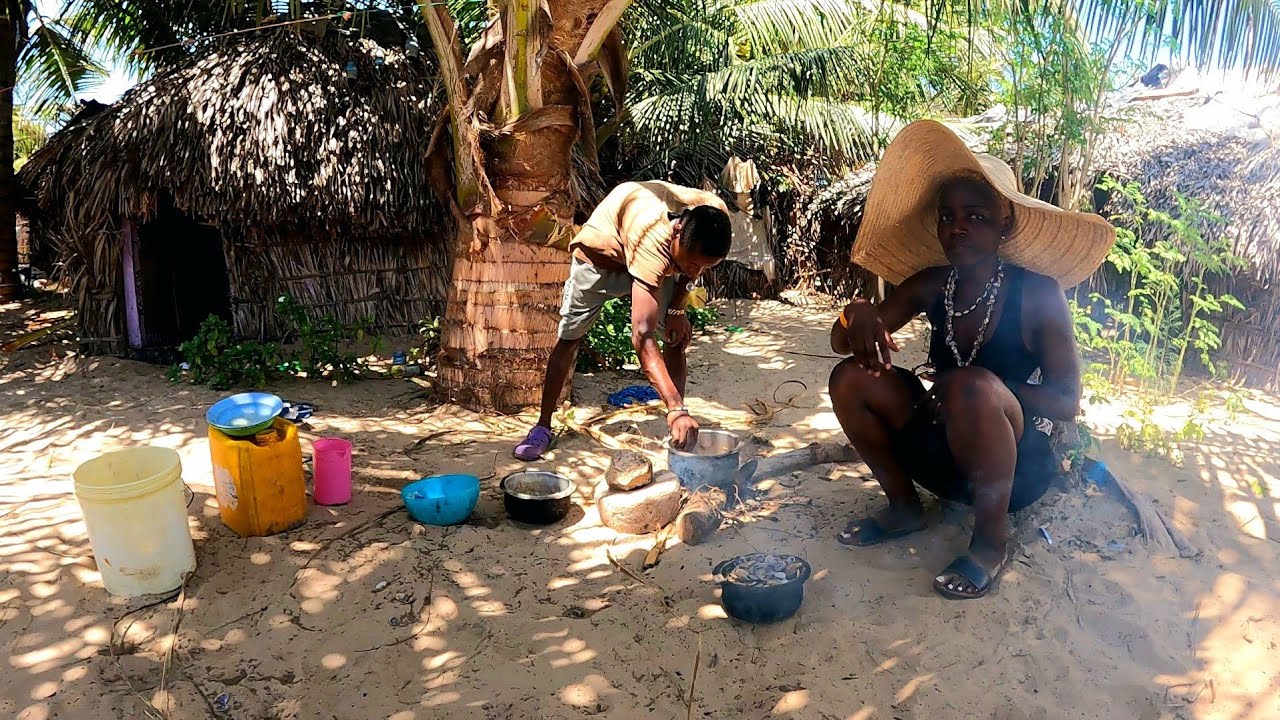 African village cooking. preparing sea food for lunch with Strangers ...