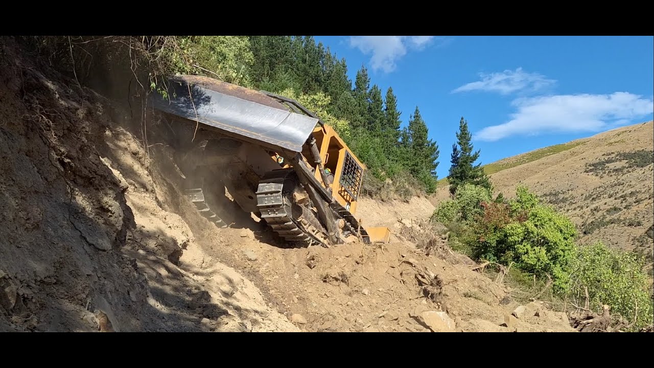 Bulldozing a Track on a Steep Hill with a Caterpillar D5 - YouTube