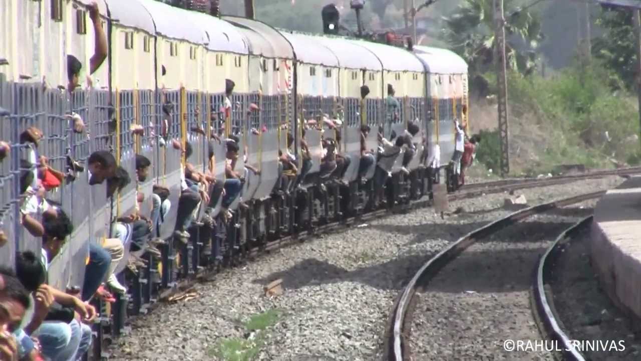 People Hanging Out of a Train at Vaitarna - YouTube