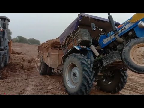 JCB tractor loading old model Indo form ful heavy load crazy driving JCB machine back loader chalana