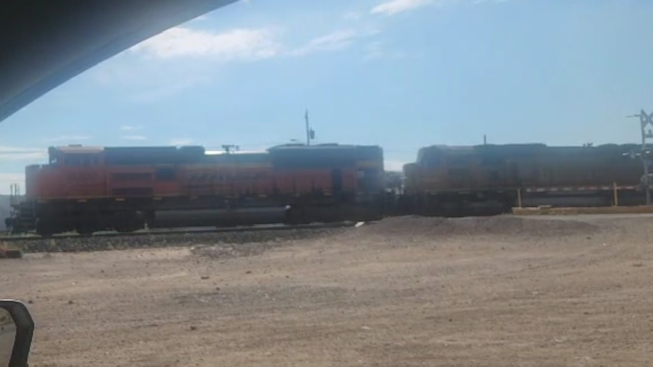 BNSF 9009 leads a long Empty coal with a MAC through Thermopolis ...