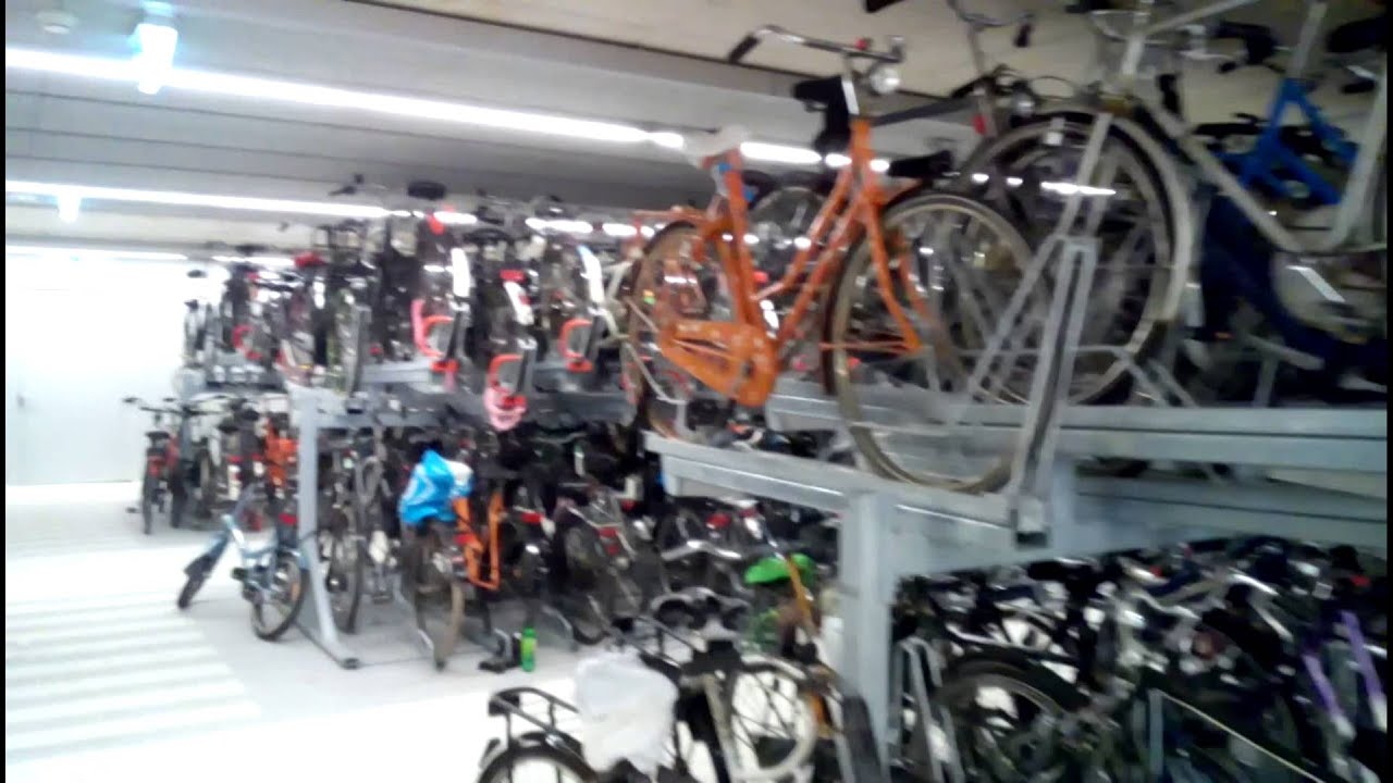 Delft railway station: underground bicycle storage - YouTube