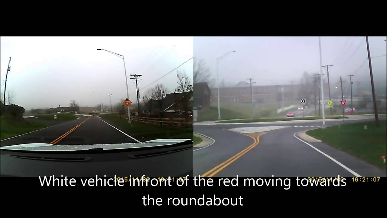 TESLA near collision at roundabout - YouTube