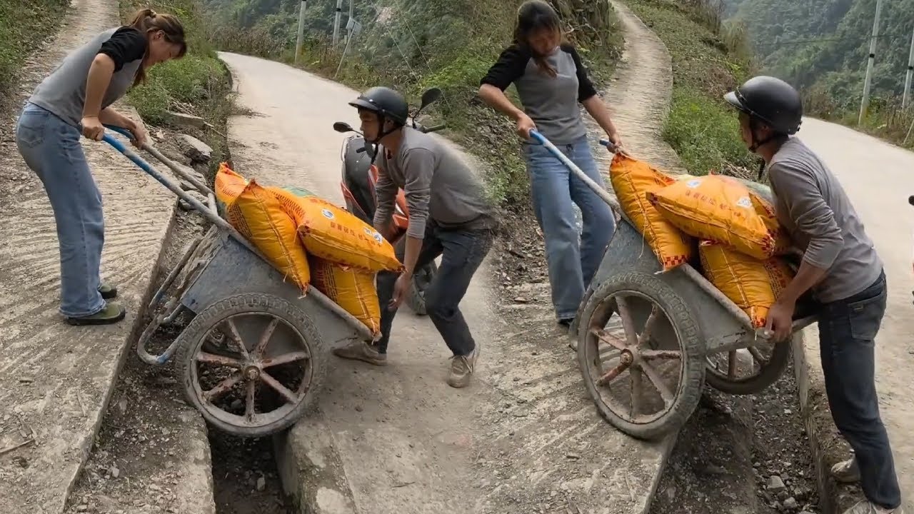 A righteous passerby helped the young lady push her cart over the bump ...