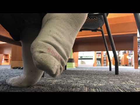 Shoeless Study At The Library In Worn White Socks