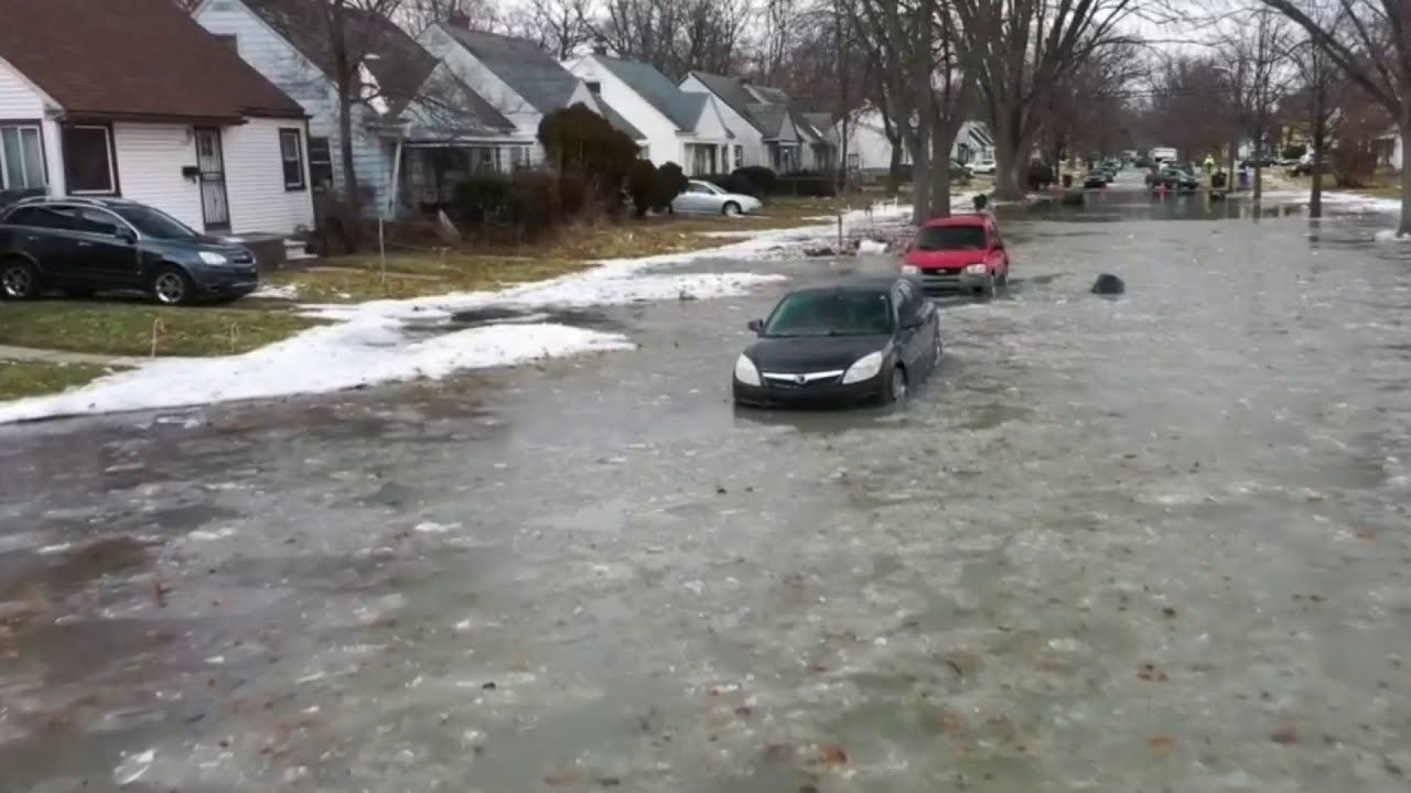 Water main break leaves entire neighborhood in frozen pond - YouTube