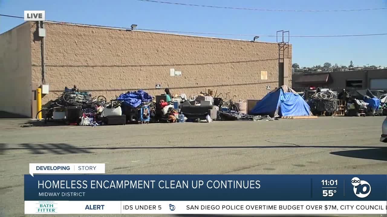 Garbage crews help clean up homeless encampment in Midway - YouTube