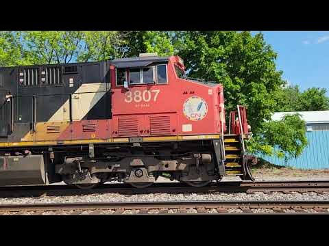 CN 3807, 3166 roll a Westbound train with an Alberta cylindrical hopper past Vicksburg, MI - YouTube