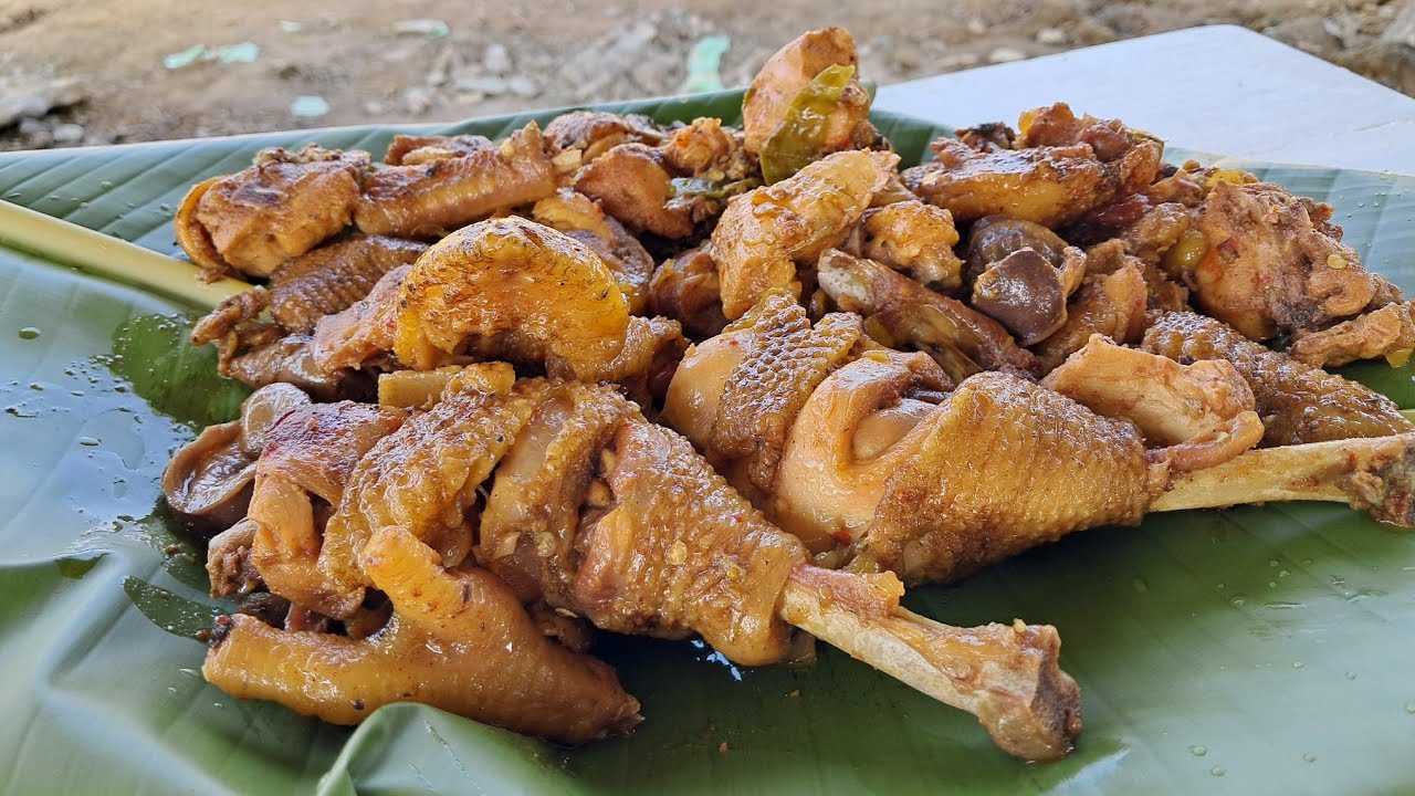 Cooking Chicken Curry in Lotha Naga Style. Chicken in bamboo shoot ...