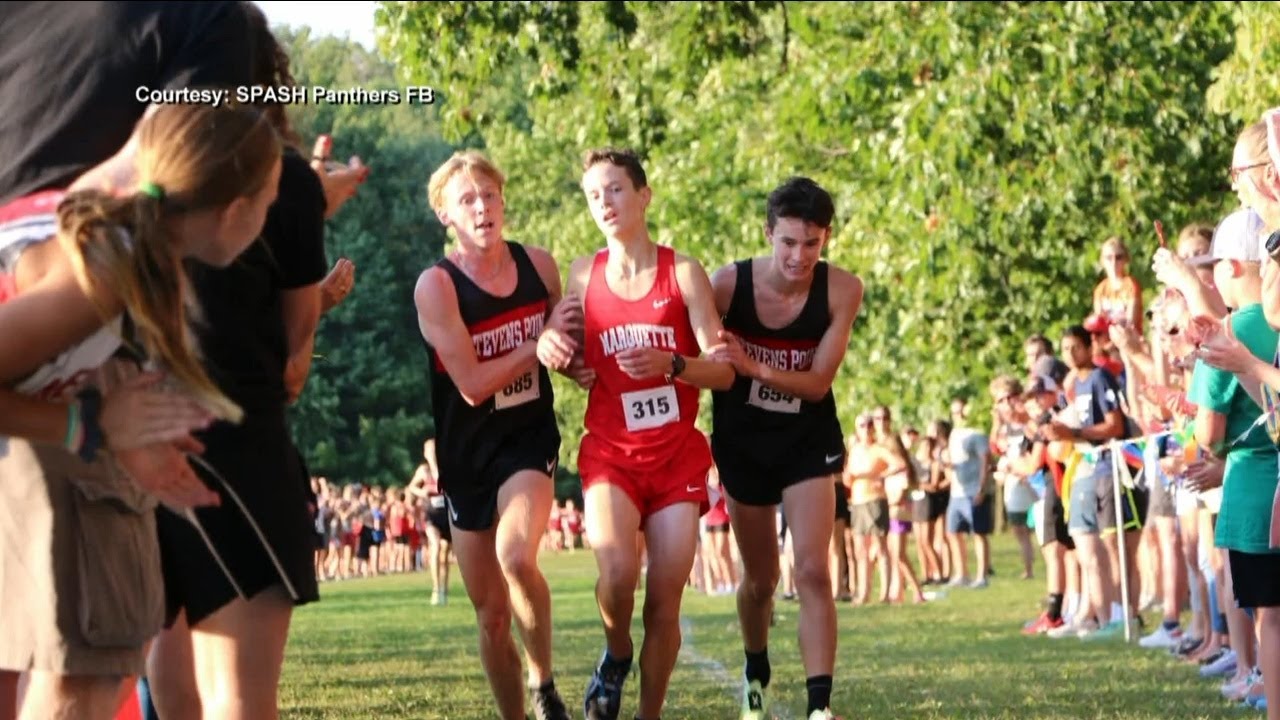 SPASH runners help competitor cross the finish line - YouTube
