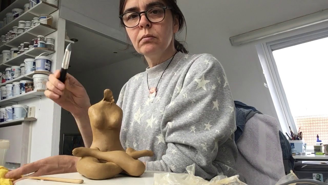 Sculpting in clay of female body in yoga position - YouTube
