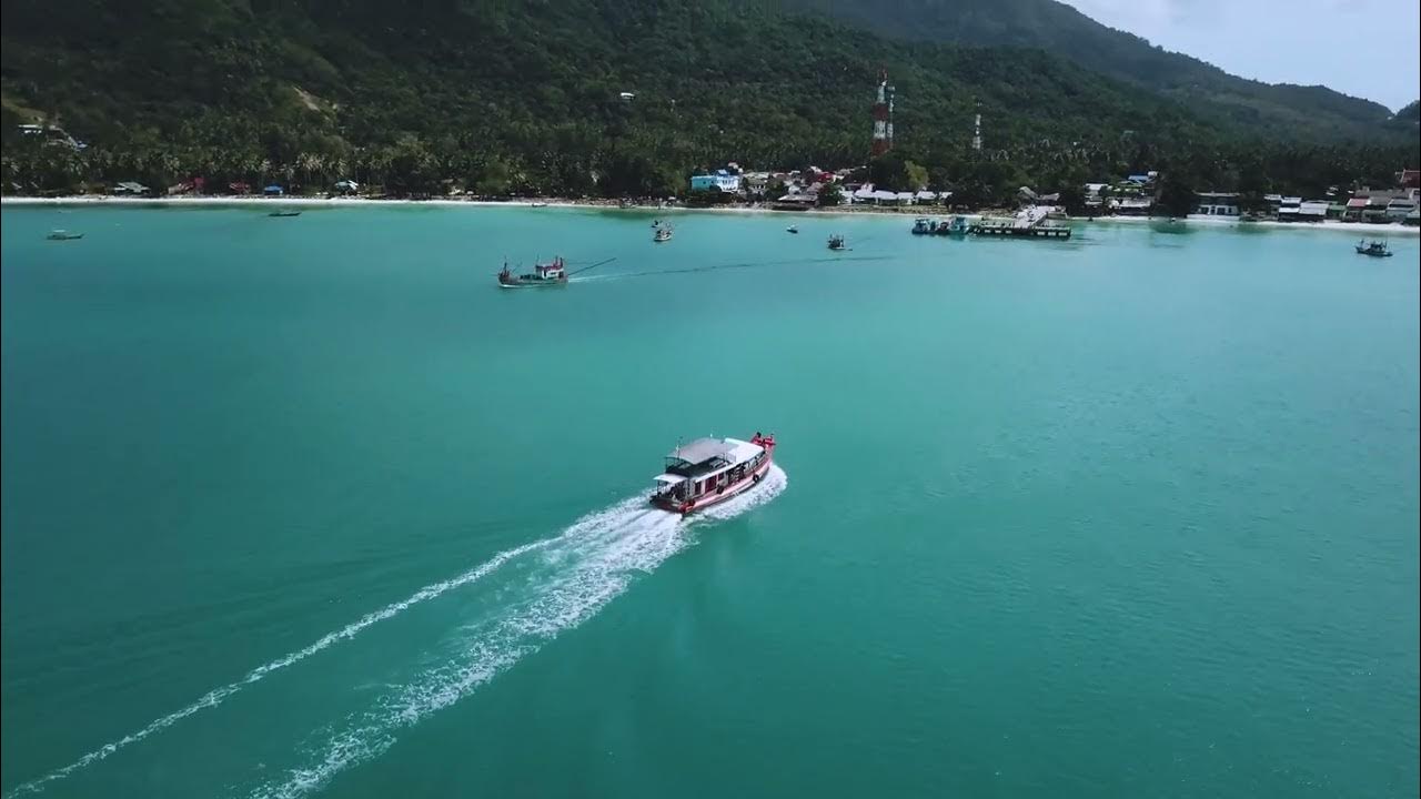 mixkit beautiful coast with motorboats and a pier seen from the 5363 4k - YouTube