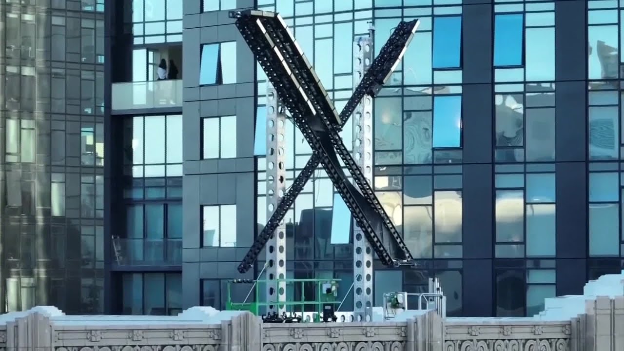 Elon Musk Places 'X' on Top of Old Twitter Building - YouTube