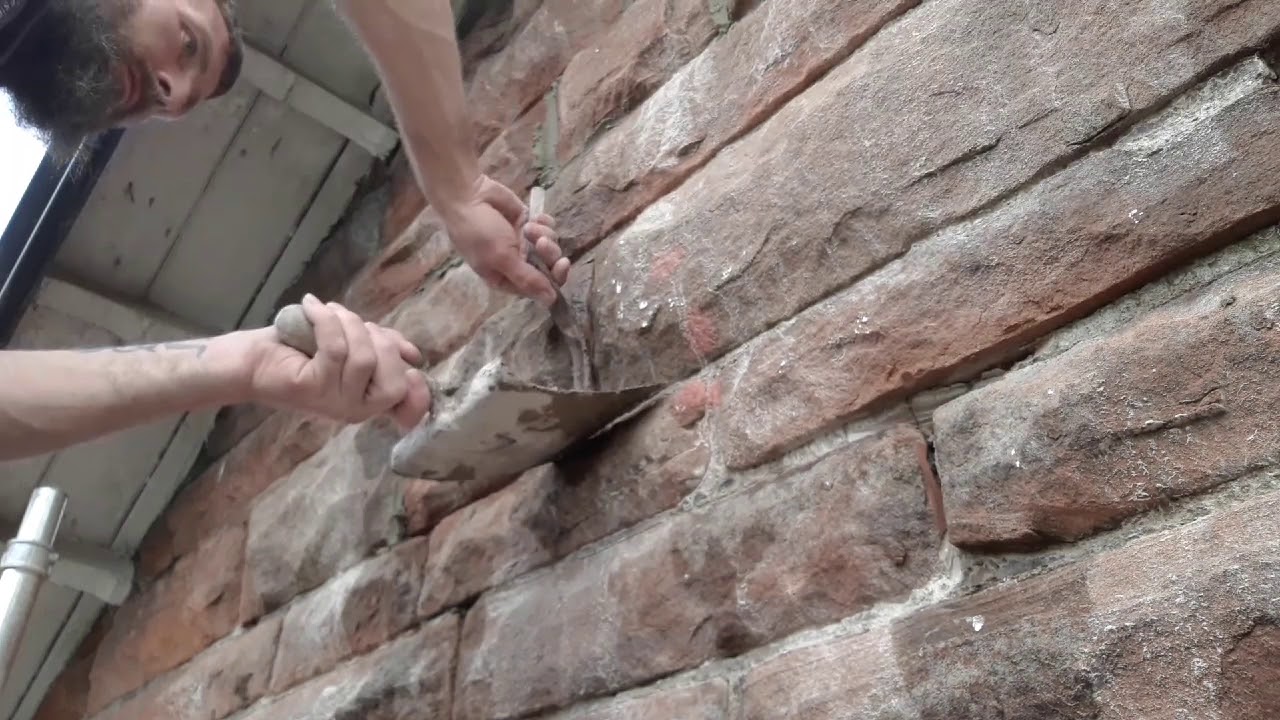 Re-pointing parts of a sandstone gable - YouTube