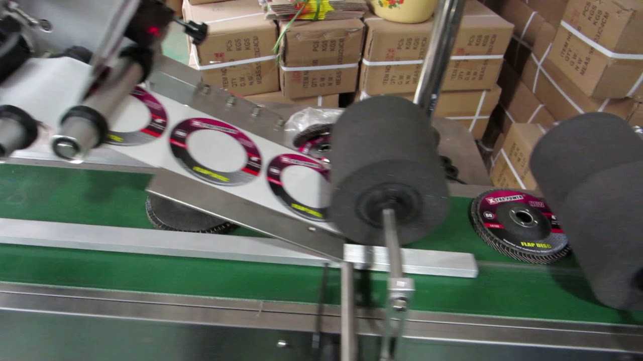 Automatic grinding wheel labeling machine - YouTube