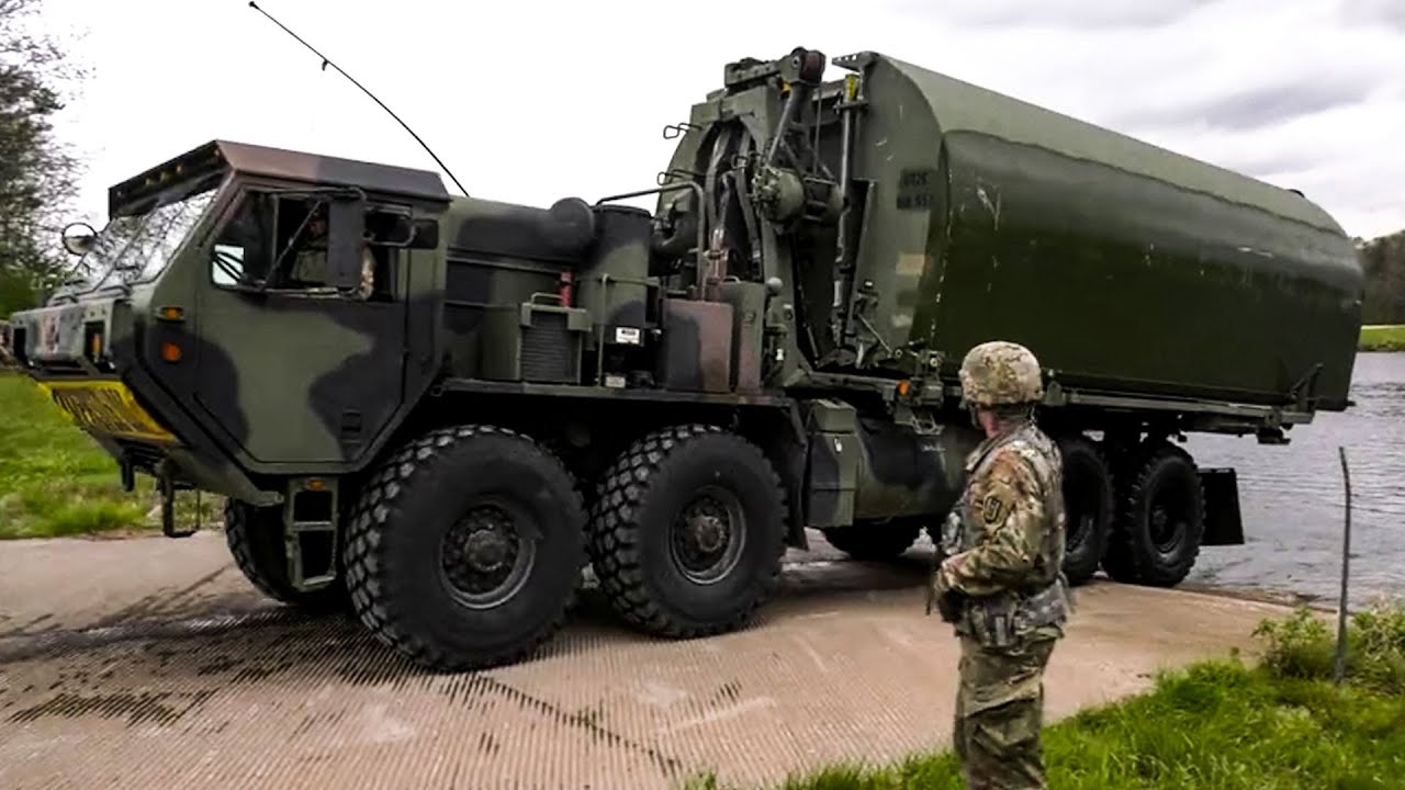 US Army Builds floating bridge to transport various military vehicles ...