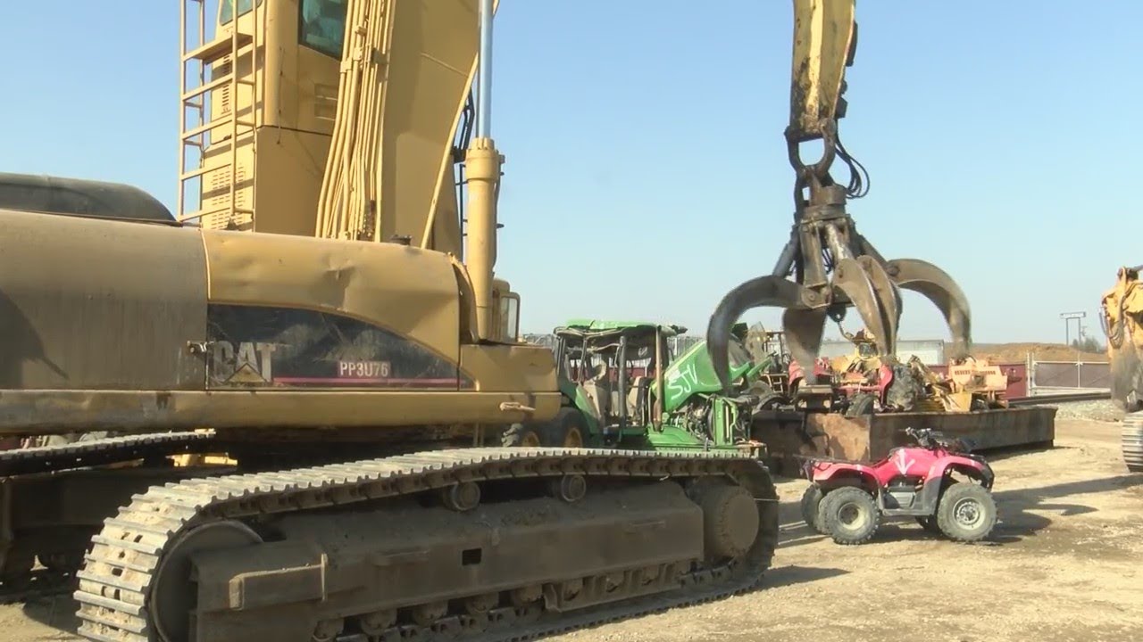 Tractors crushed - YouTube