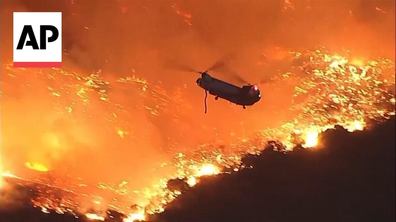 Helicopters battle flames as Palisades Fire burns on Santa Monica ...