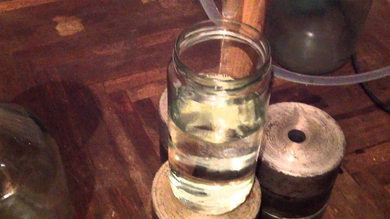 Distilling corn mash for making whiskey - YouTube
