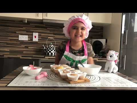 Nila is making Mickey cupcakes and decorating with icing for kids #kids #Nila
