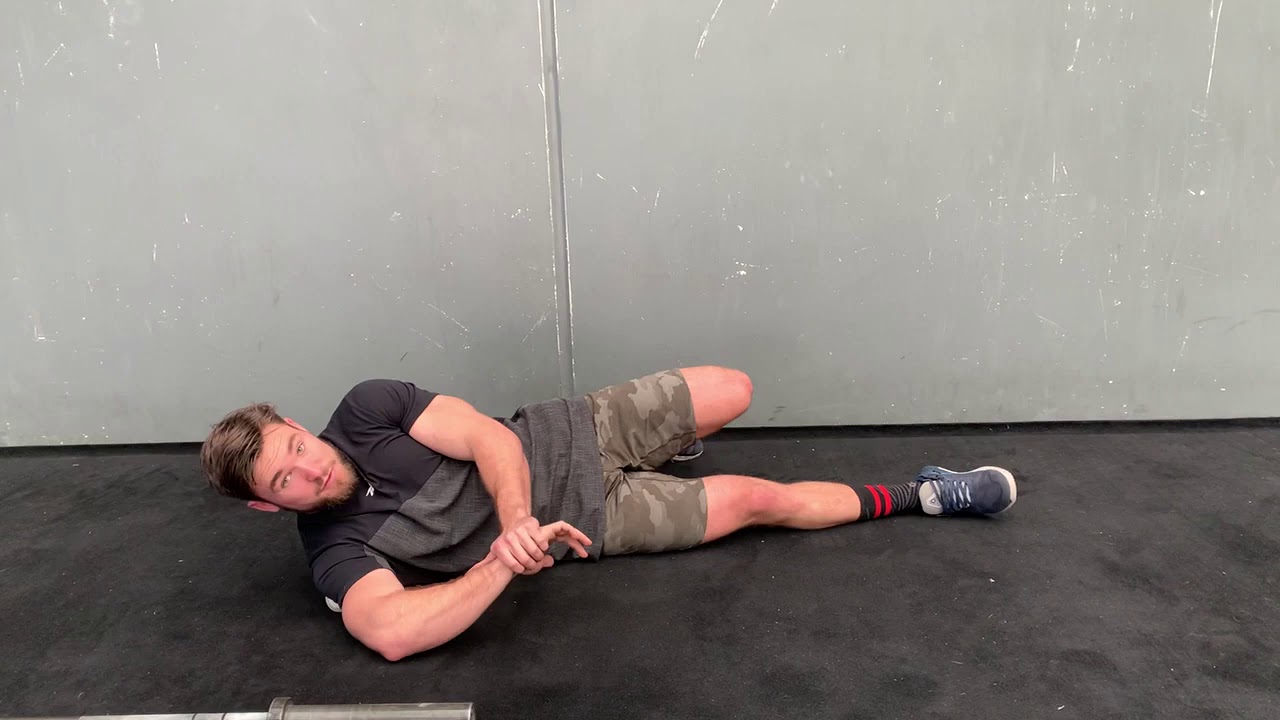Front rack prep- sleeper stretch with lacrosse ball & barbell front ...