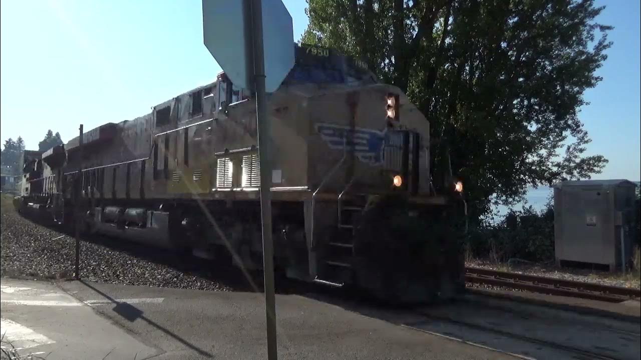 (Northbound) UP Intermodal Train passes through the Sunnyside Beach Pedestrian Railroad Crossing ...