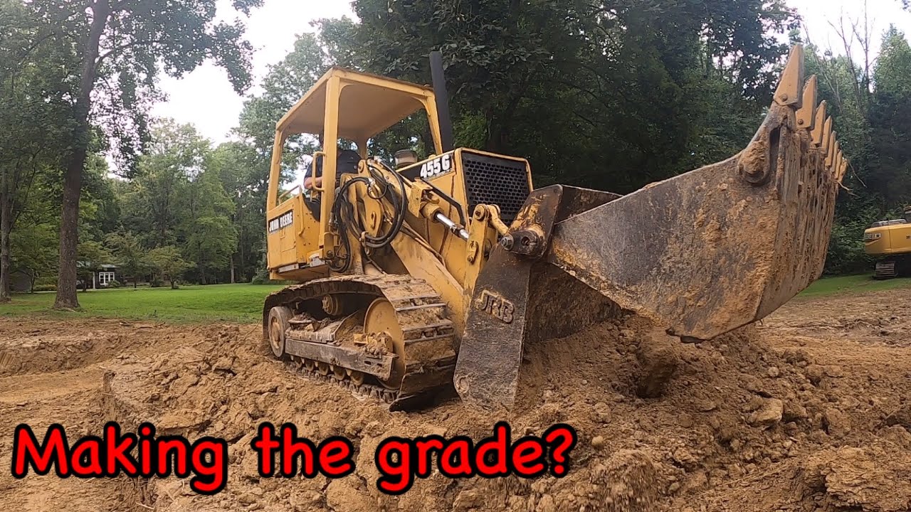 We put the John Deere 455G in the dirt! Cutting finish grade and moving ...