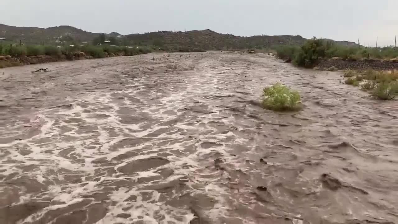 Flooding seen in the New River wash Friday afternoon - YouTube