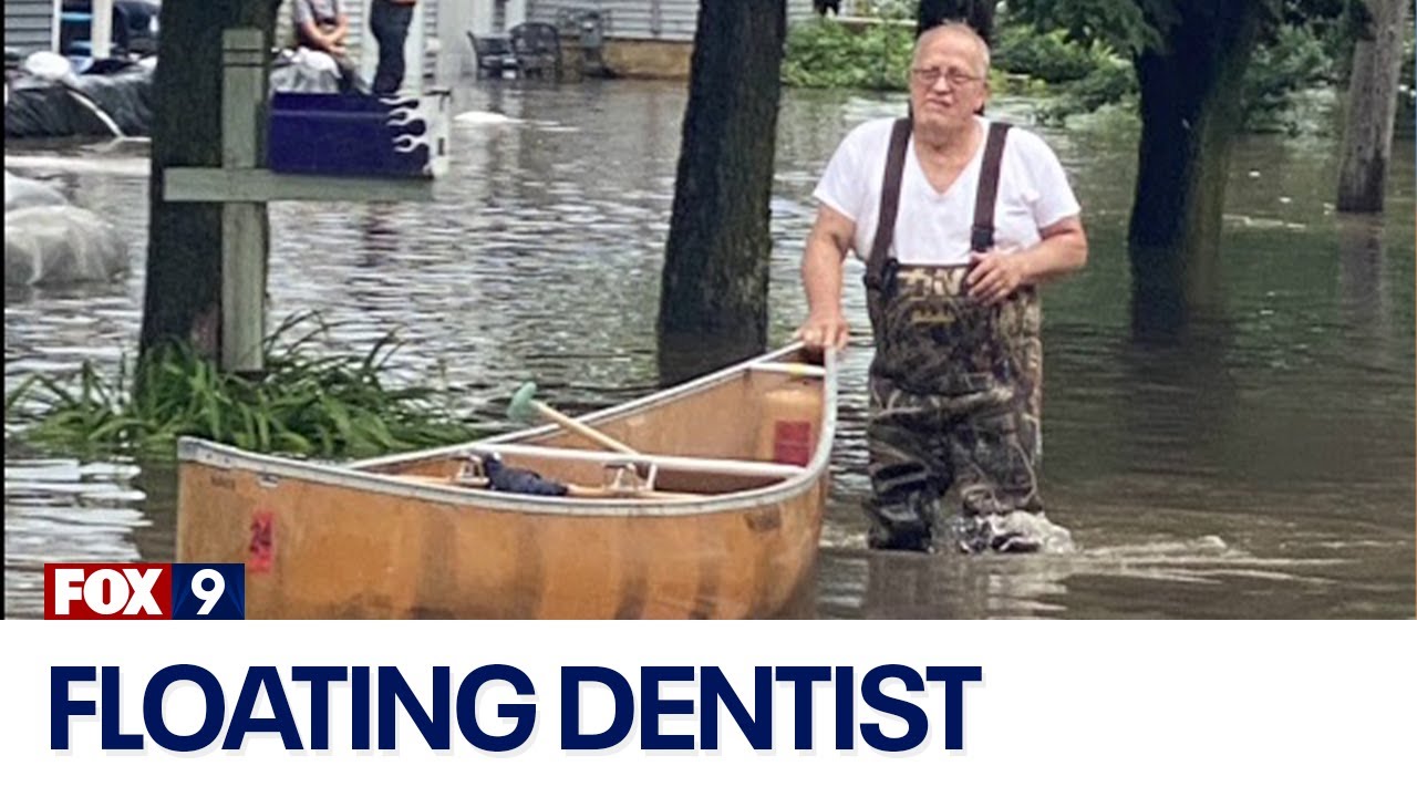 Waterville dentist uses canoe to ferry patients in during flood - YouTube