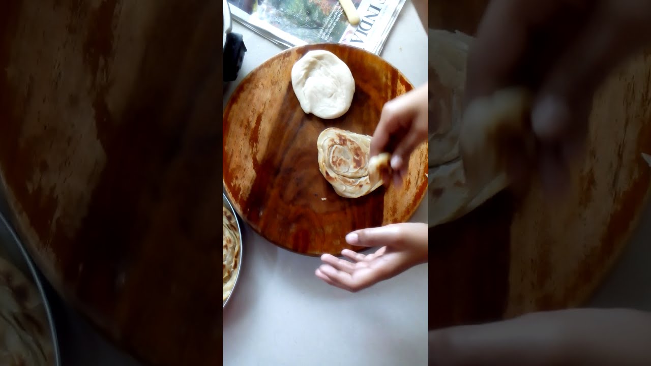 How to roll parotta .. by parotta master😁 - YouTube