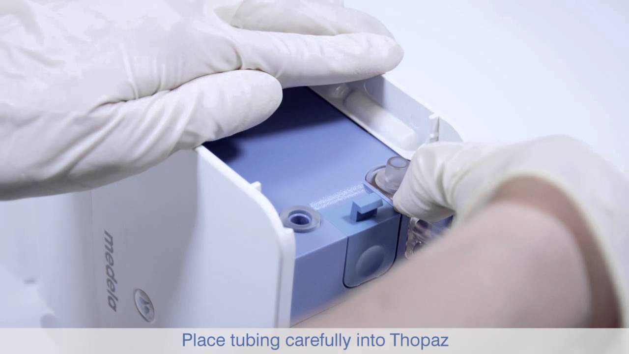 Medela Thopaz: Attaching canister and tubing - English - YouTube