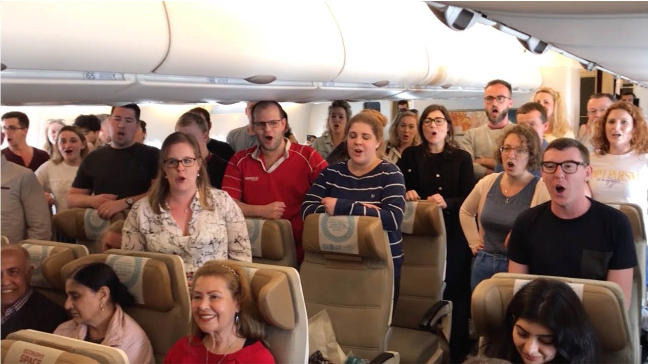 Choir Sing National Anthem On Plane - YouTube