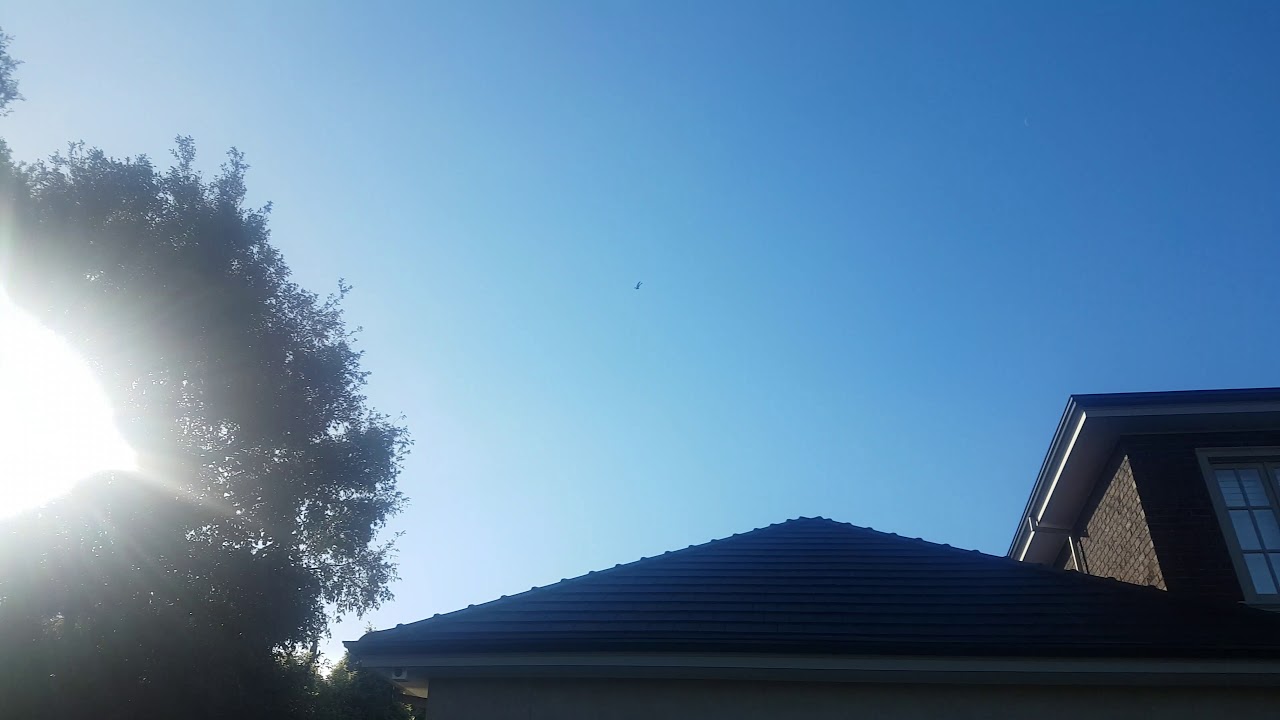 Rainbow in a practically cloudless sky. - YouTube