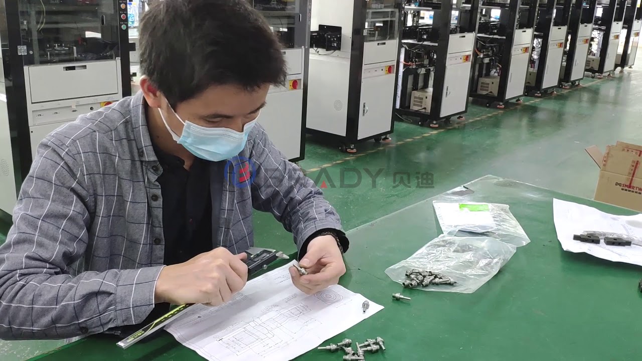 Automatic screw locking machine workshop states from Brady - YouTube