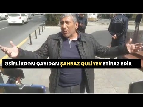 Əsirlikdən qayıdan Şahbaz Quliyev etiraz edir və qolunu polislər burub etiraz edərkən.