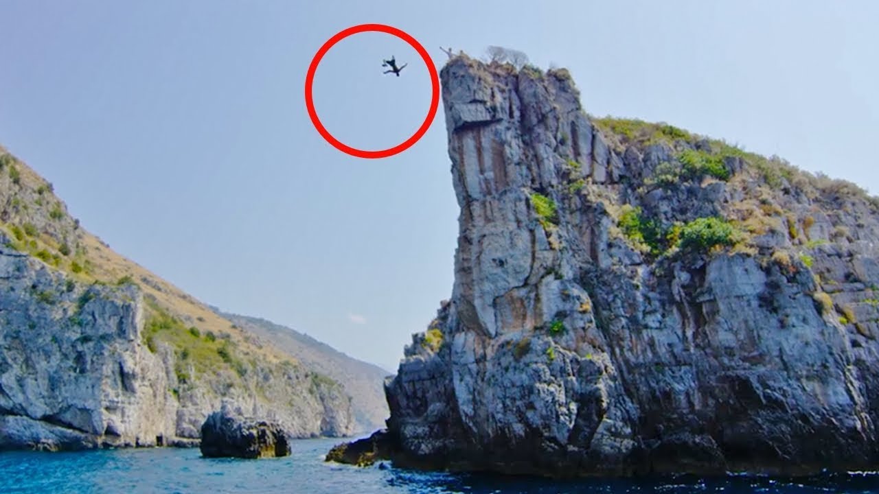 Worst cliff jump injury ever captured on film with 2 broken legs - YouTube