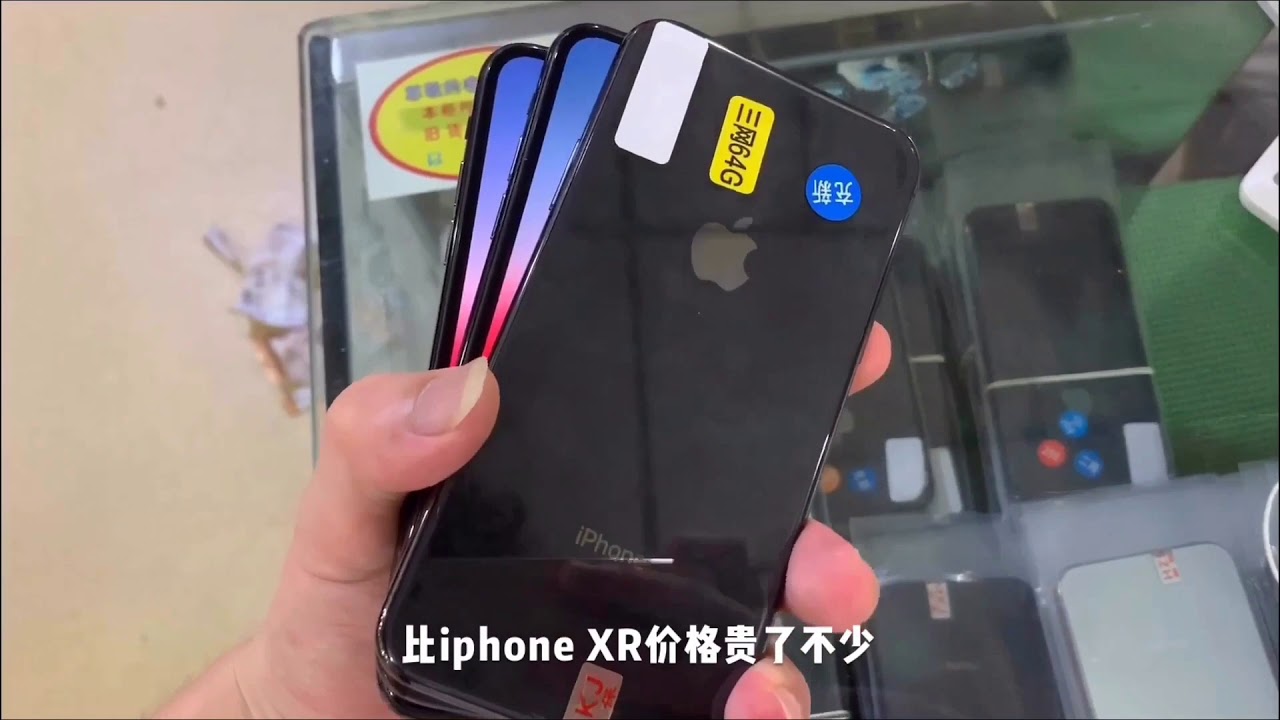 Mobile phone man in Shenzhen, China helps customers choose a machine ...