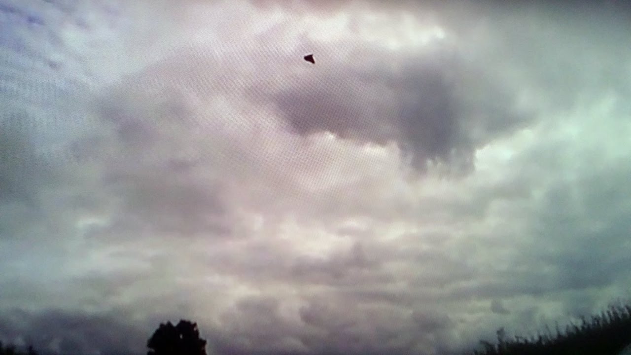 Real triangle UFO flying from portal - YouTube