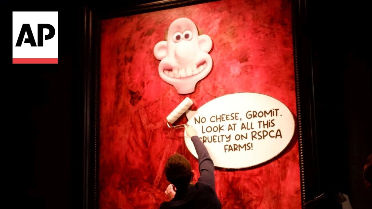 WATCH: Animal rights protesters deface King Charles III portrait in ...