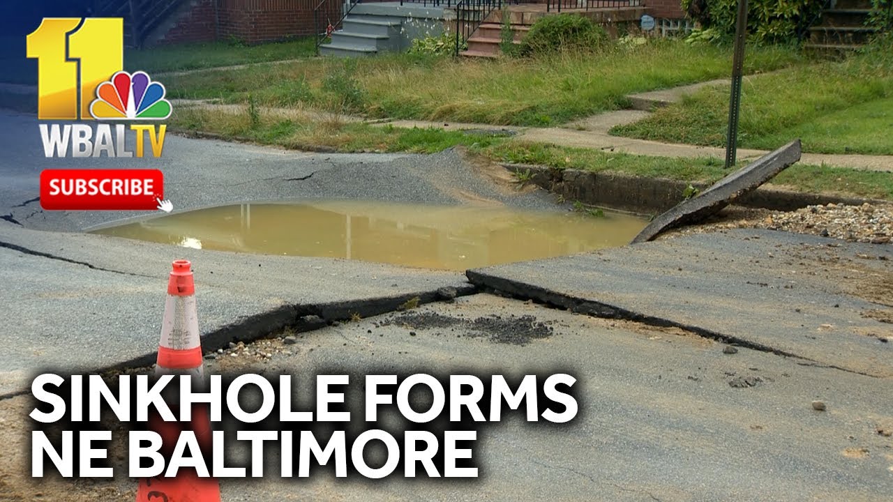 Sinkhole opens up after water main break in northeast Baltimore - YouTube