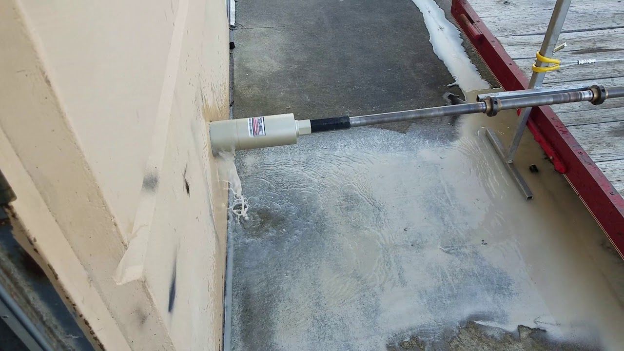Porta Mole machine being used to core bore a concrete wall - YouTube