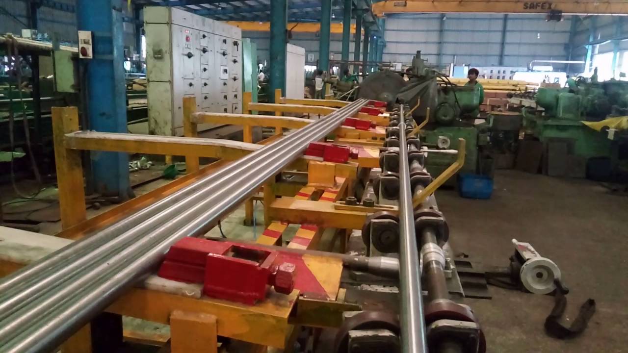 Automated loading and unloading off bright bar centerlessgrinder - YouTube