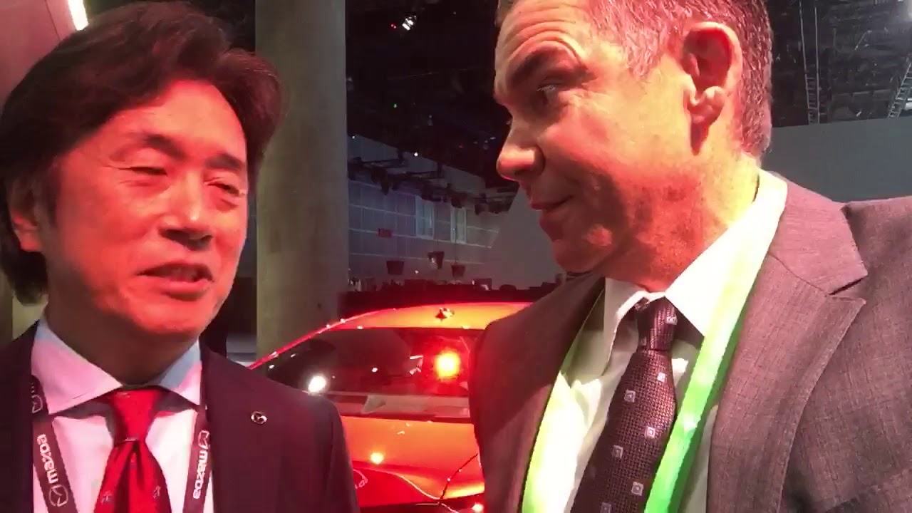 Masahiro Moro, President of Mazda North America and John Patterson ...