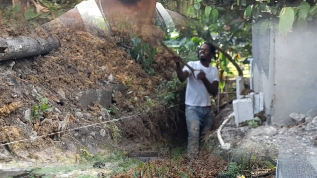 How to dig out a foundation to run wall /in jamaica man power - YouTube