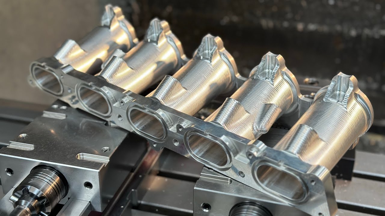 Finishing the outside profile of the billet intake runners on the Haas ...